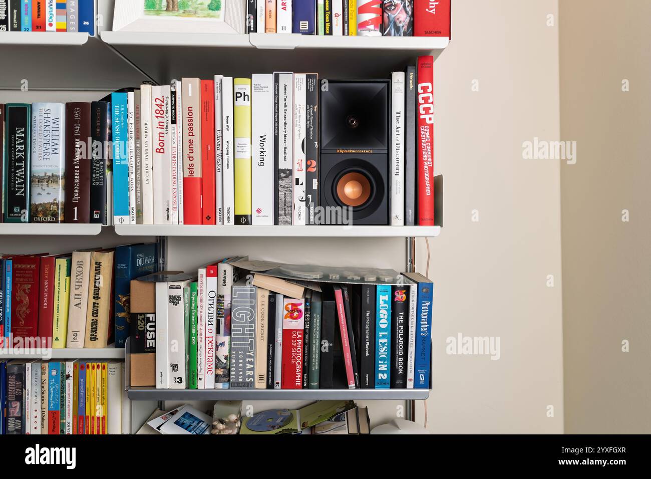 Paris, France - Apr 18, 2023: A cleanly arranged bookshelf featuring an ...