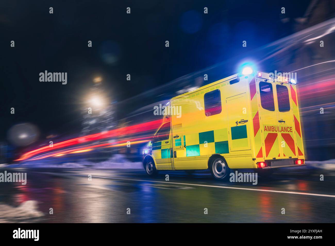 Ambulance car of emergency medical service in blurred motion on road at ...