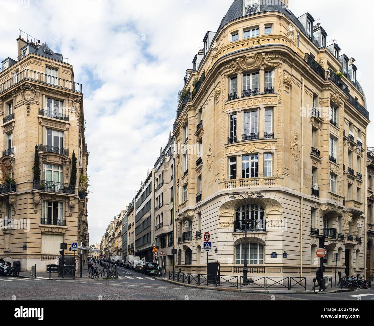 Street in Paris with beautiful buildings and parked cars. Paris, France ...
