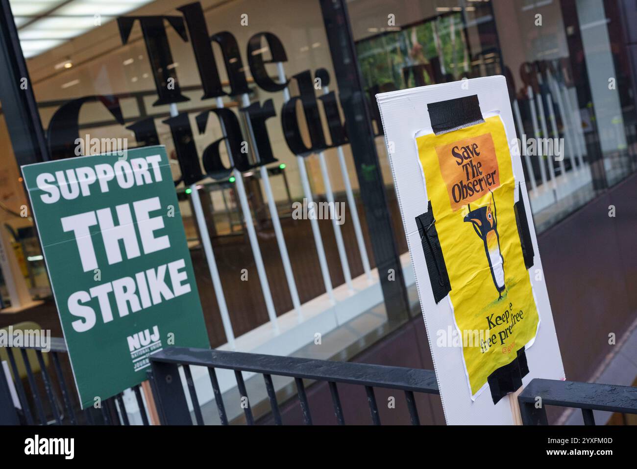 Placards are seen outside The Guardian and Observer newspaper offices ...