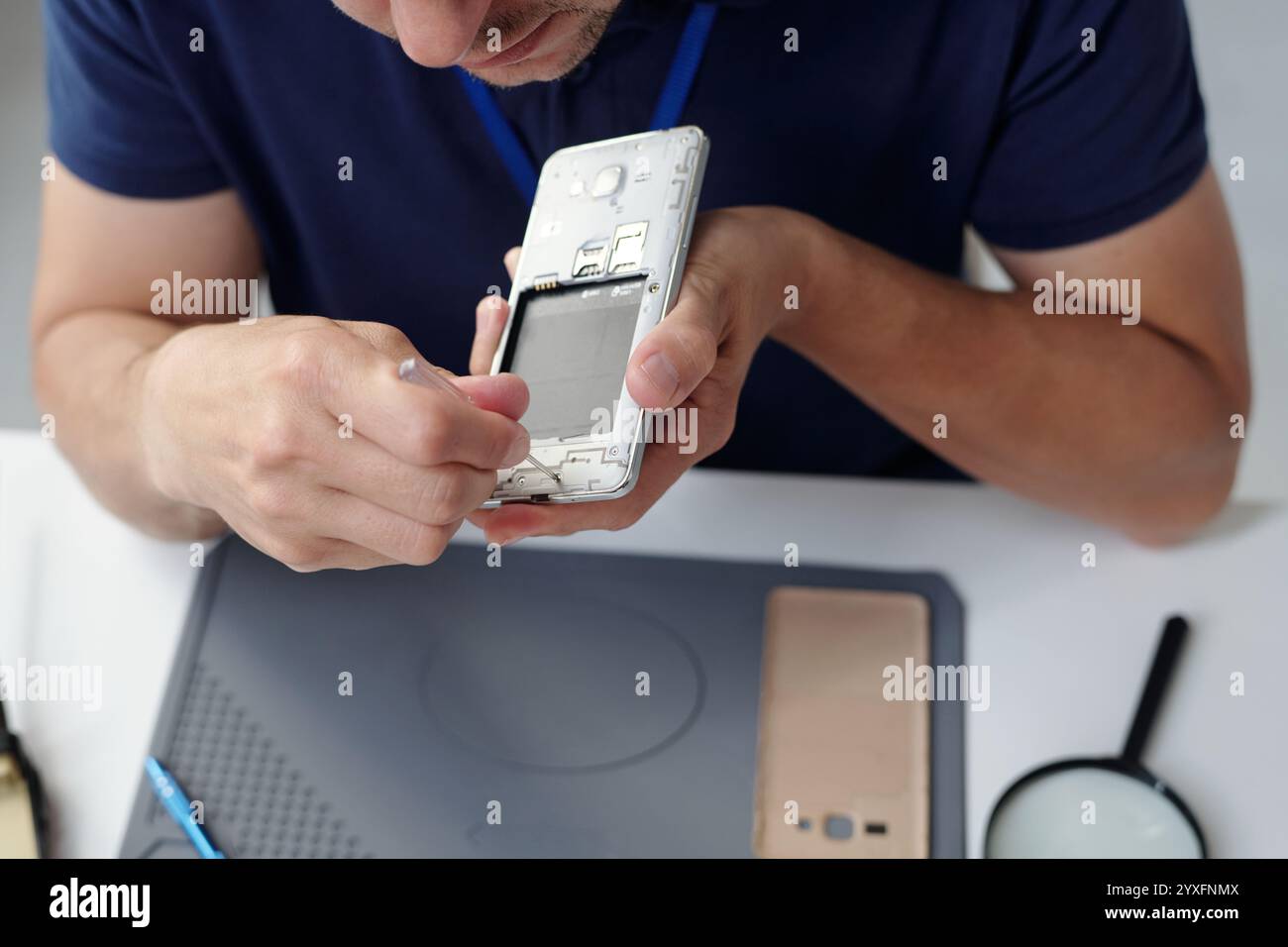 Repairing Smartphone at Electronic Repair Workshop Stock Photo - Alamy
