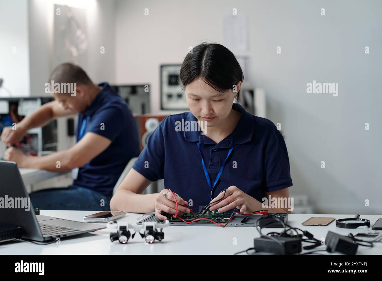 Focused Engineer Soldering Circuit Board in Lab Setting Stock Photo - Alamy