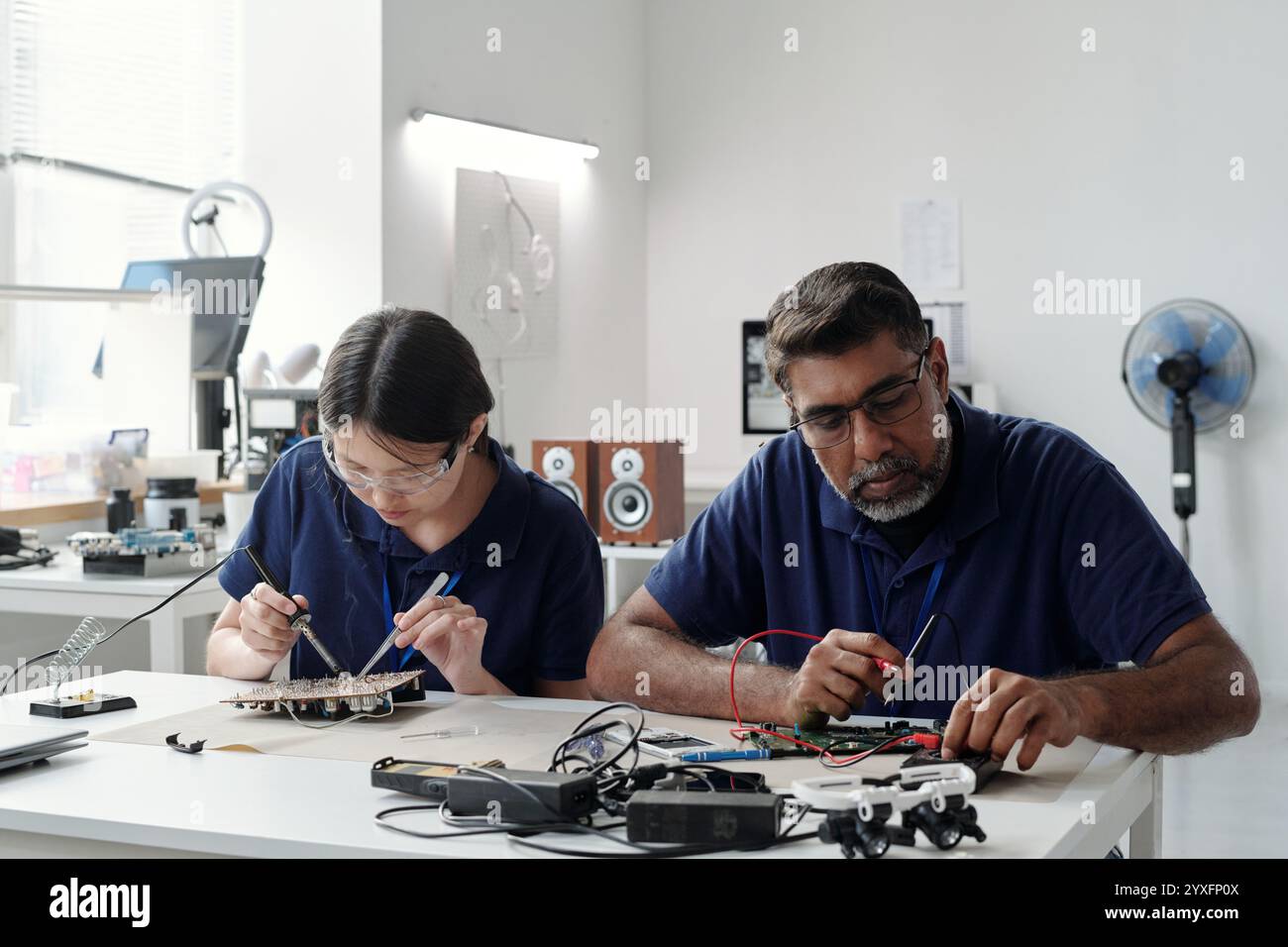 Collaborative Engineers Working on Circuit Boards in Lab Stock Photo ...