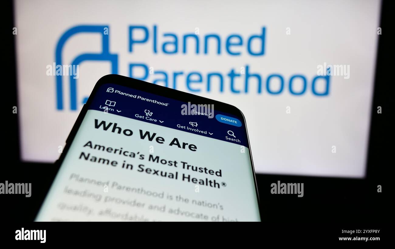 In this photo illustration, a smartphone with the website of Planned ...