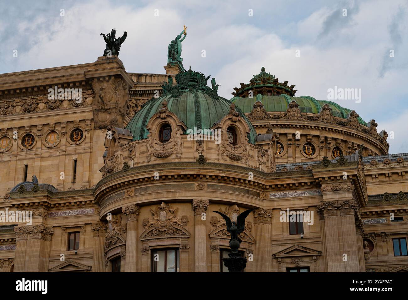 Historic architectural details of a grand theater building featuring a ...