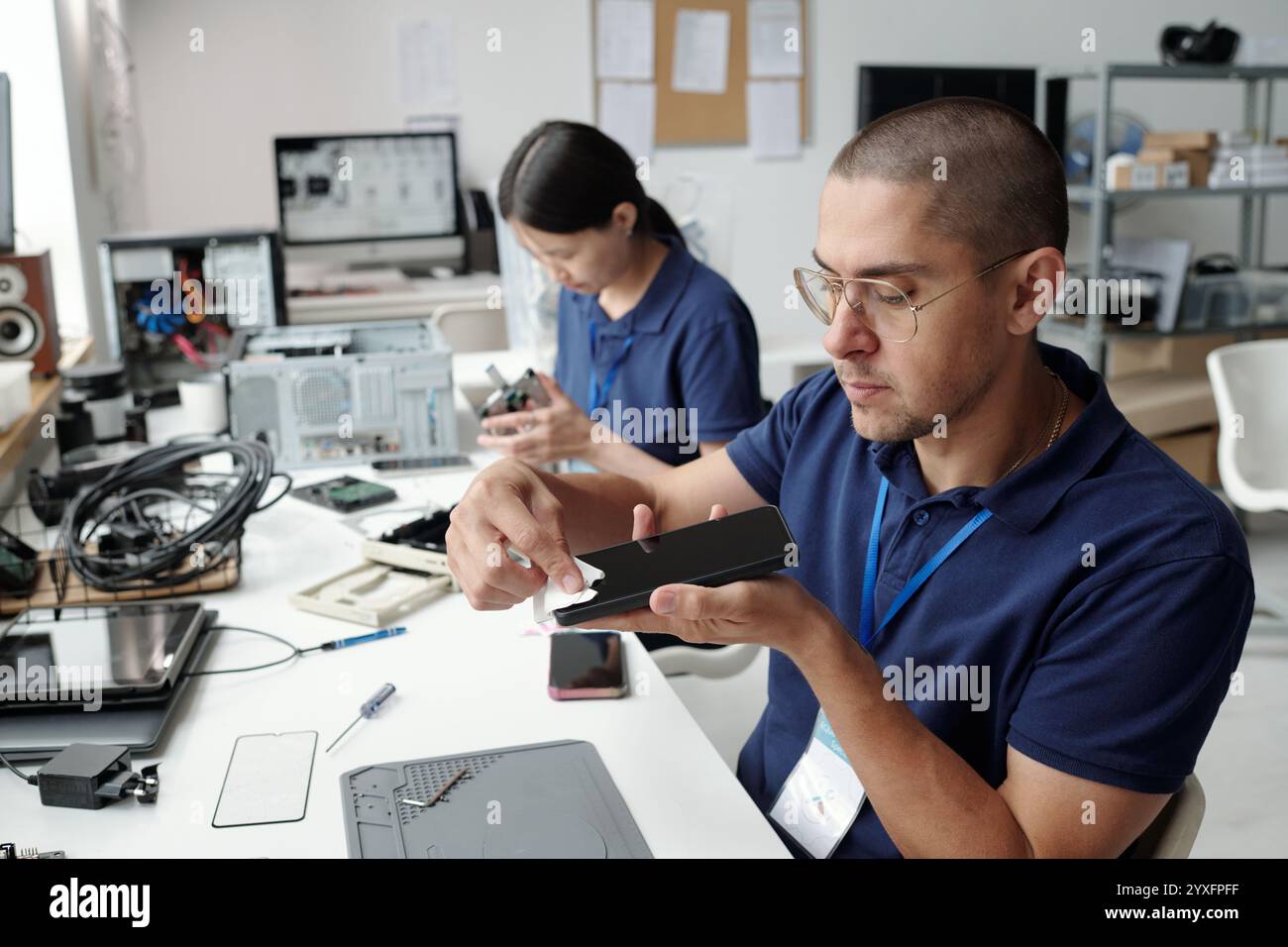 Engineers Assembling Electronic Device Inside Office Setting Stock ...
