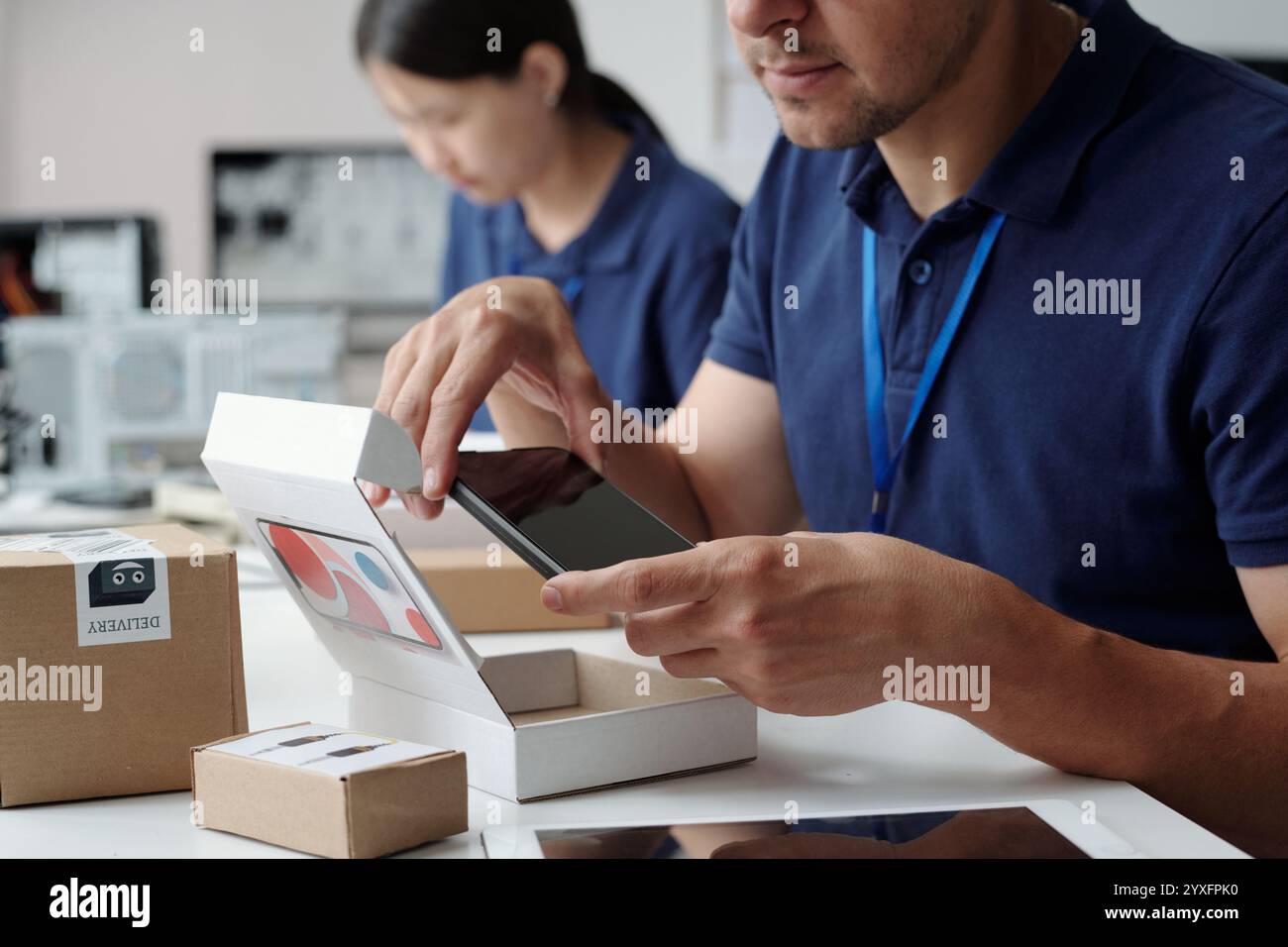 Inspecting New Smartphone in Technology Workshop Setting Stock Photo ...