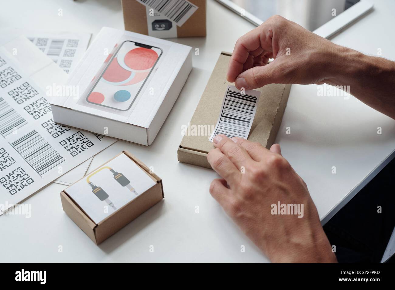 Preparing Shipping Packages With QR Codes in Warehouse Stock Photo - Alamy