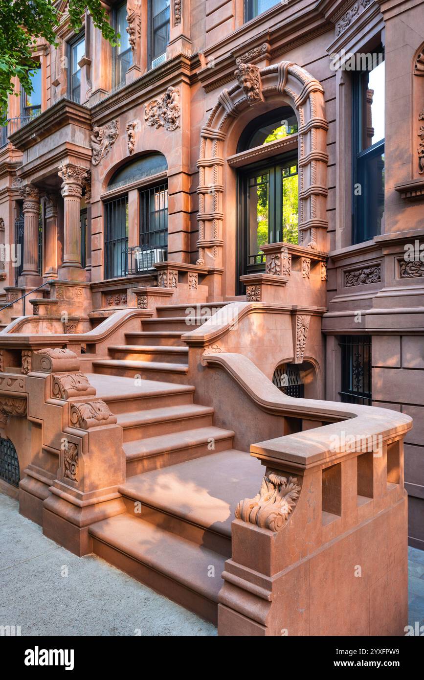Brownstones and townhouses with stone ornamentation and entry steps. Upper West Side Central ...
