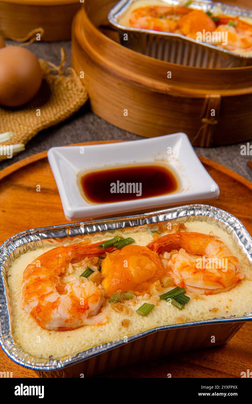 steam egg with salted egg and shrimp. Steam egg made by Eggs are beaten ...