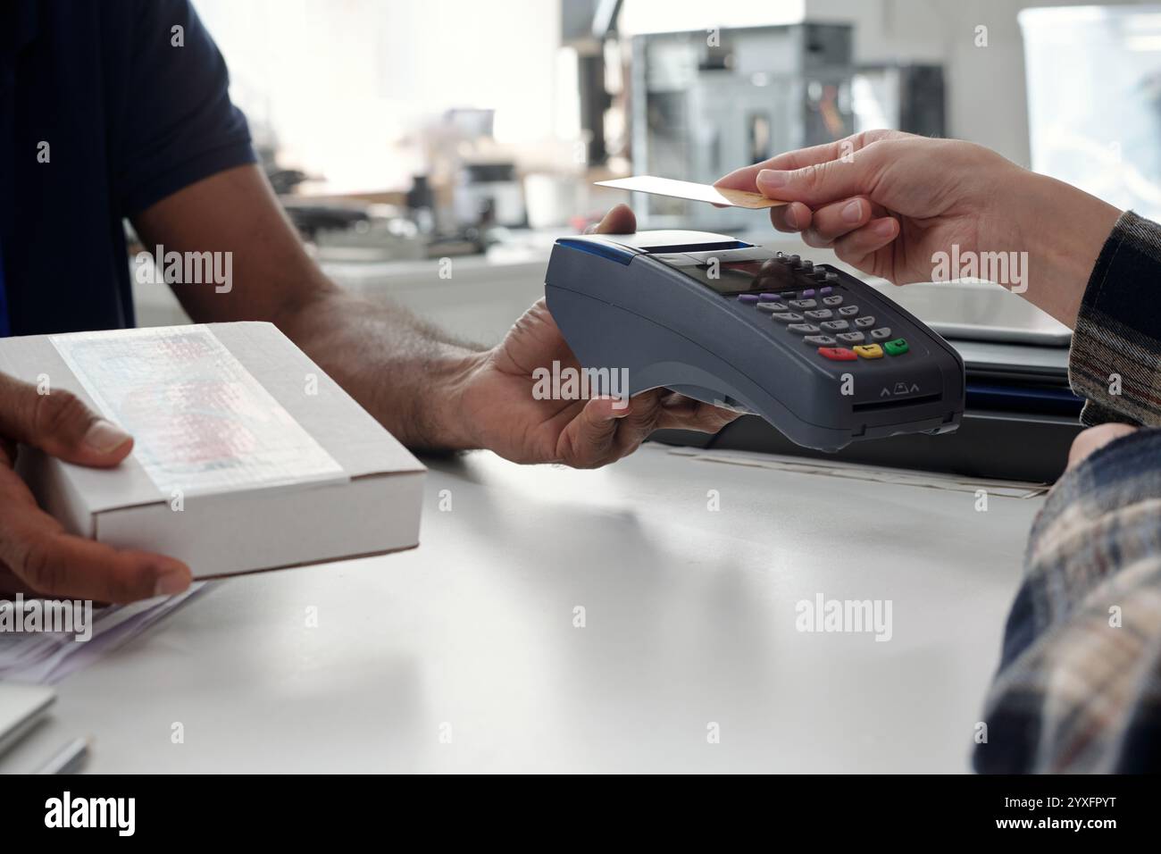 Completing Payment Transaction in Retail Store Stock Photo - Alamy