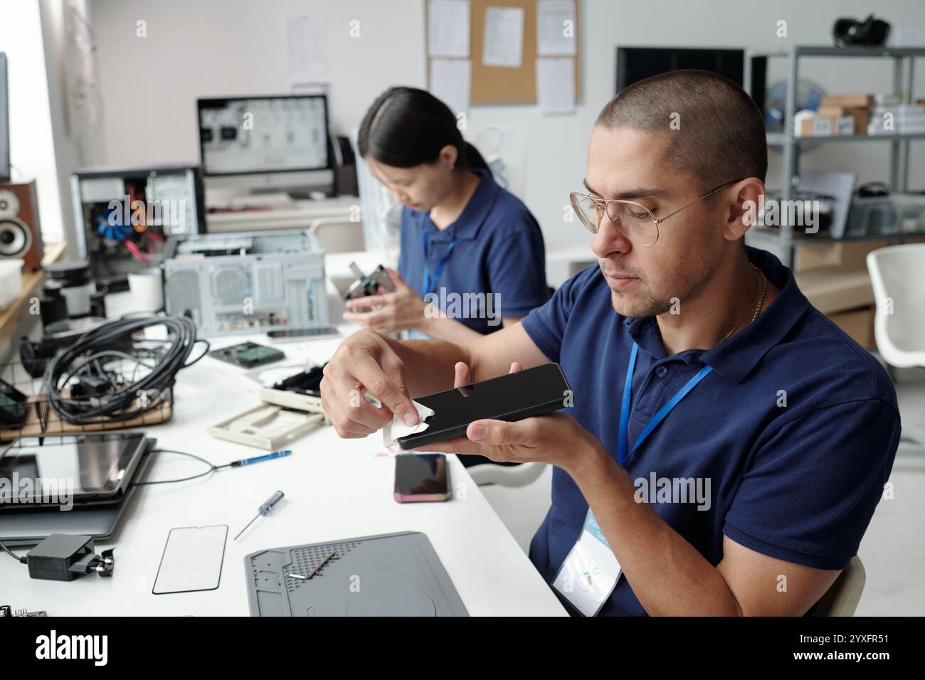 Professional engineers working innovative equipment hi-res stock ...