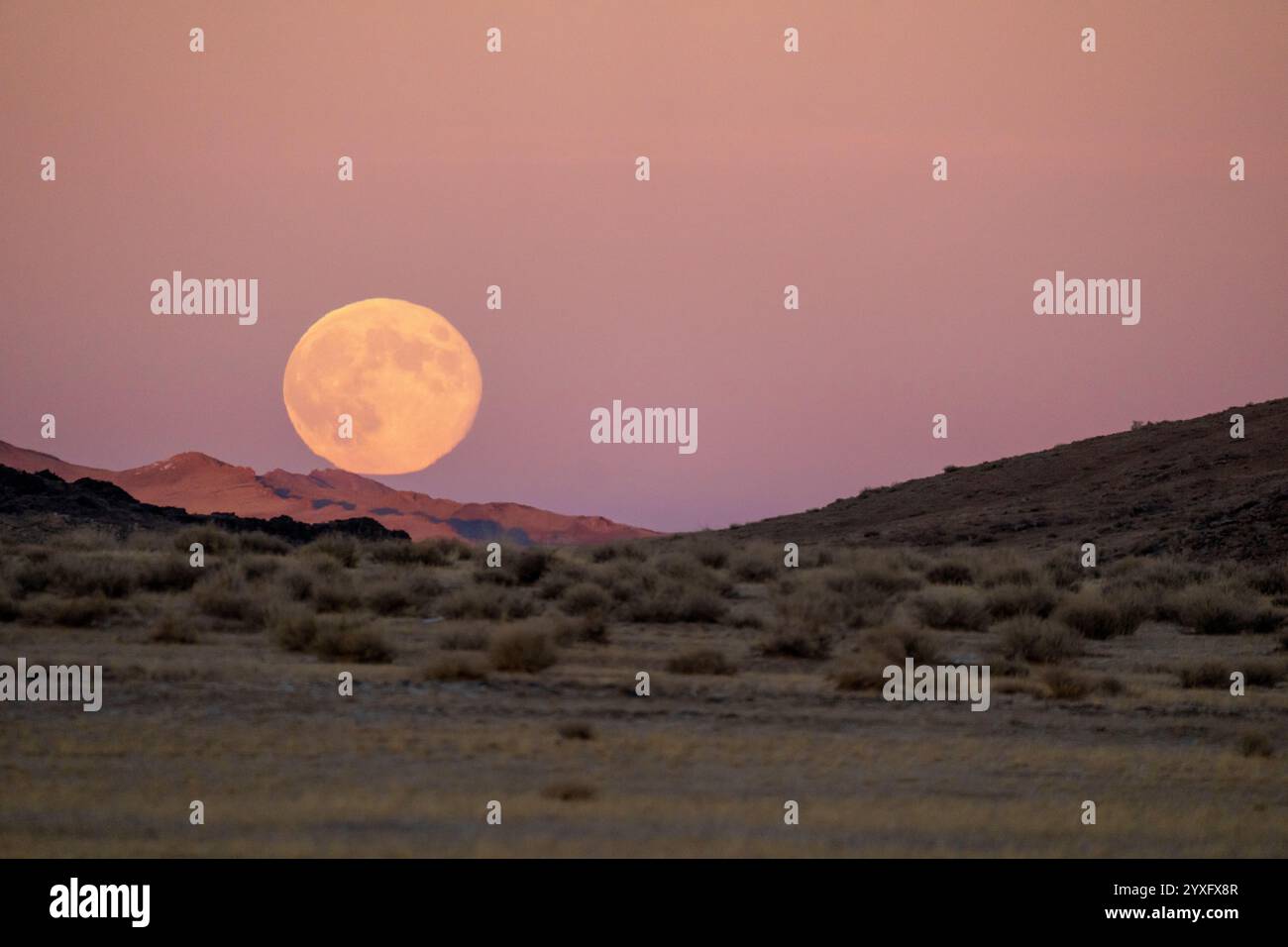 Full moon over dry temperate steppe and mountain regions in western ...