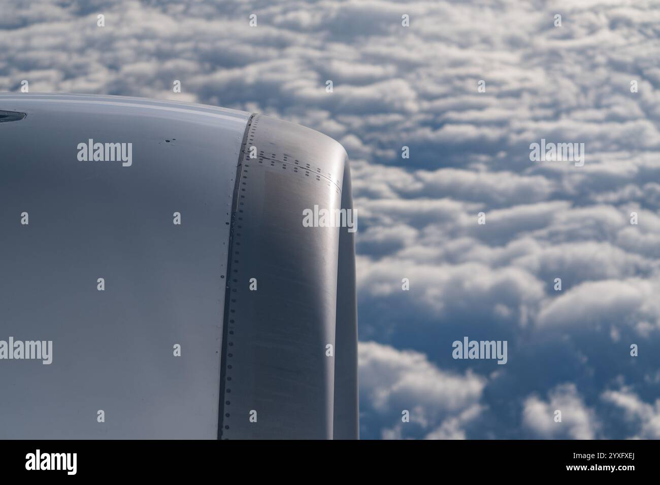 Airplane engine and wings on the sky Stock Photo - Alamy