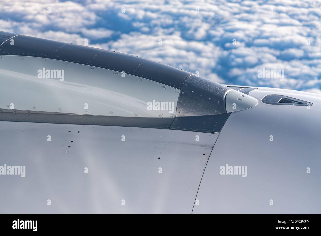 Airplane engine and wings on the sky Stock Photo - Alamy