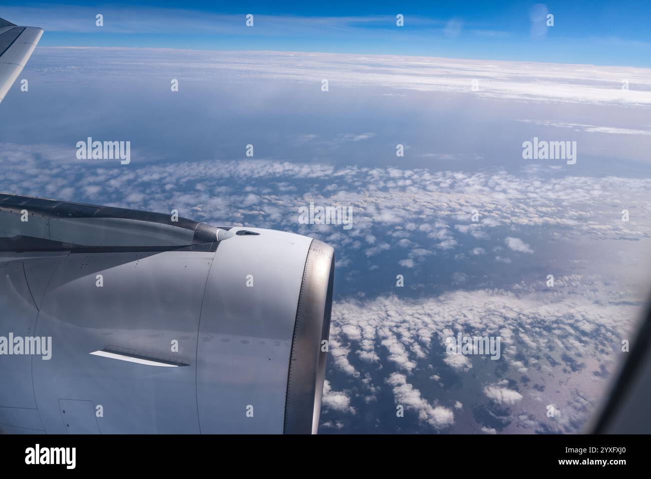 Airplane engine and wings on the sky Stock Photo - Alamy
