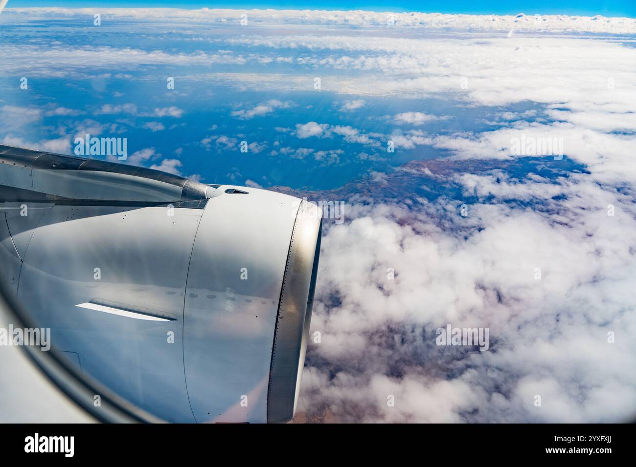 A commercial airplane flying high in the sky looking through a window ...