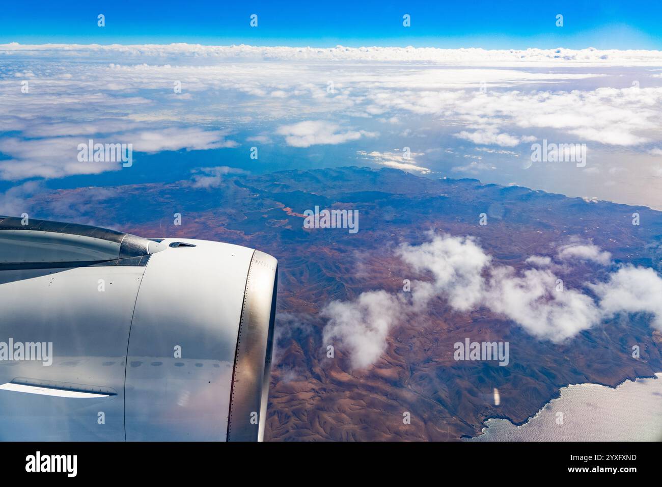 A commercial airplane flying high in the sky looking through a window ...