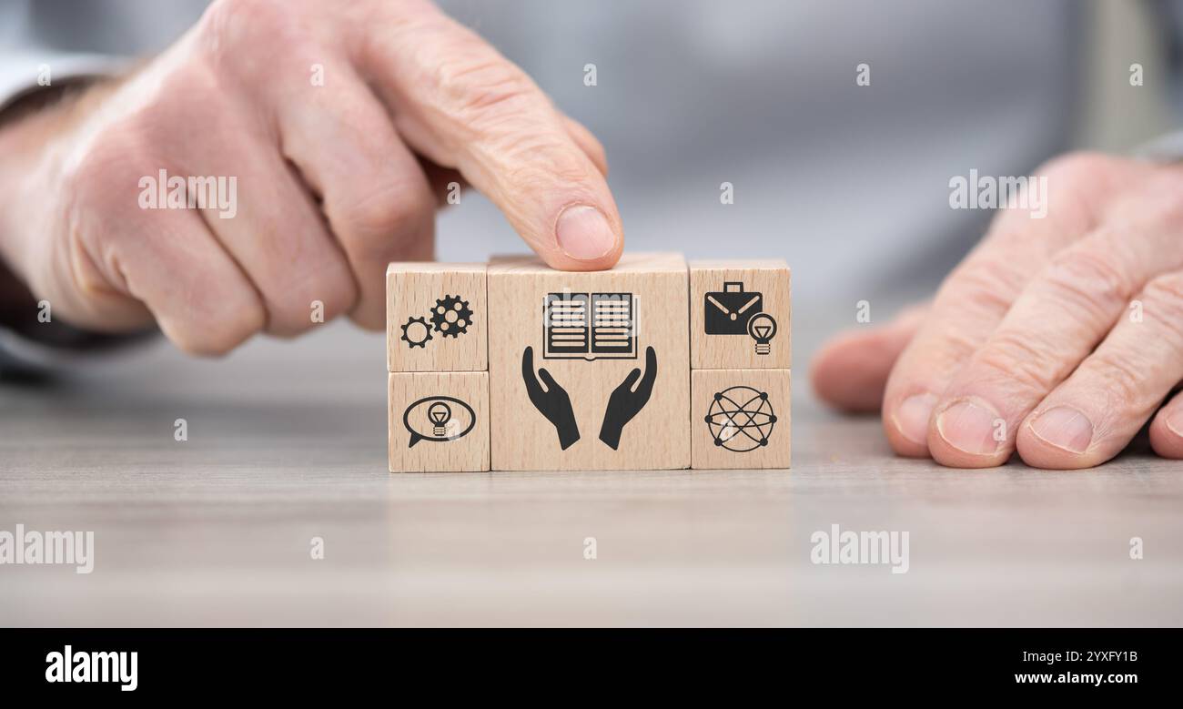 Wooden blocks with symbol of knowledge concept Stock Photo - Alamy