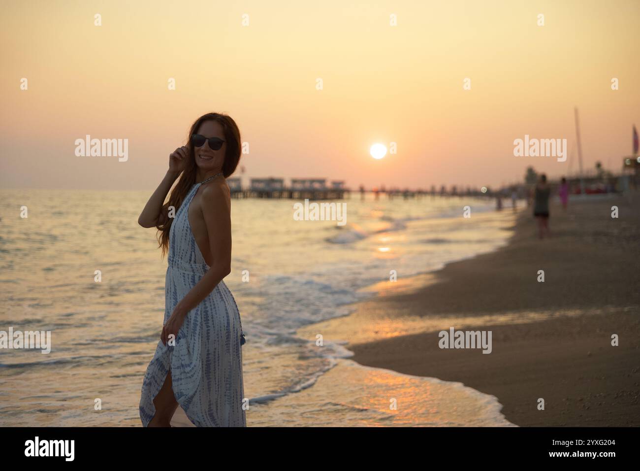 Drone woman walking along pier hi-res stock photography and images - Alamy