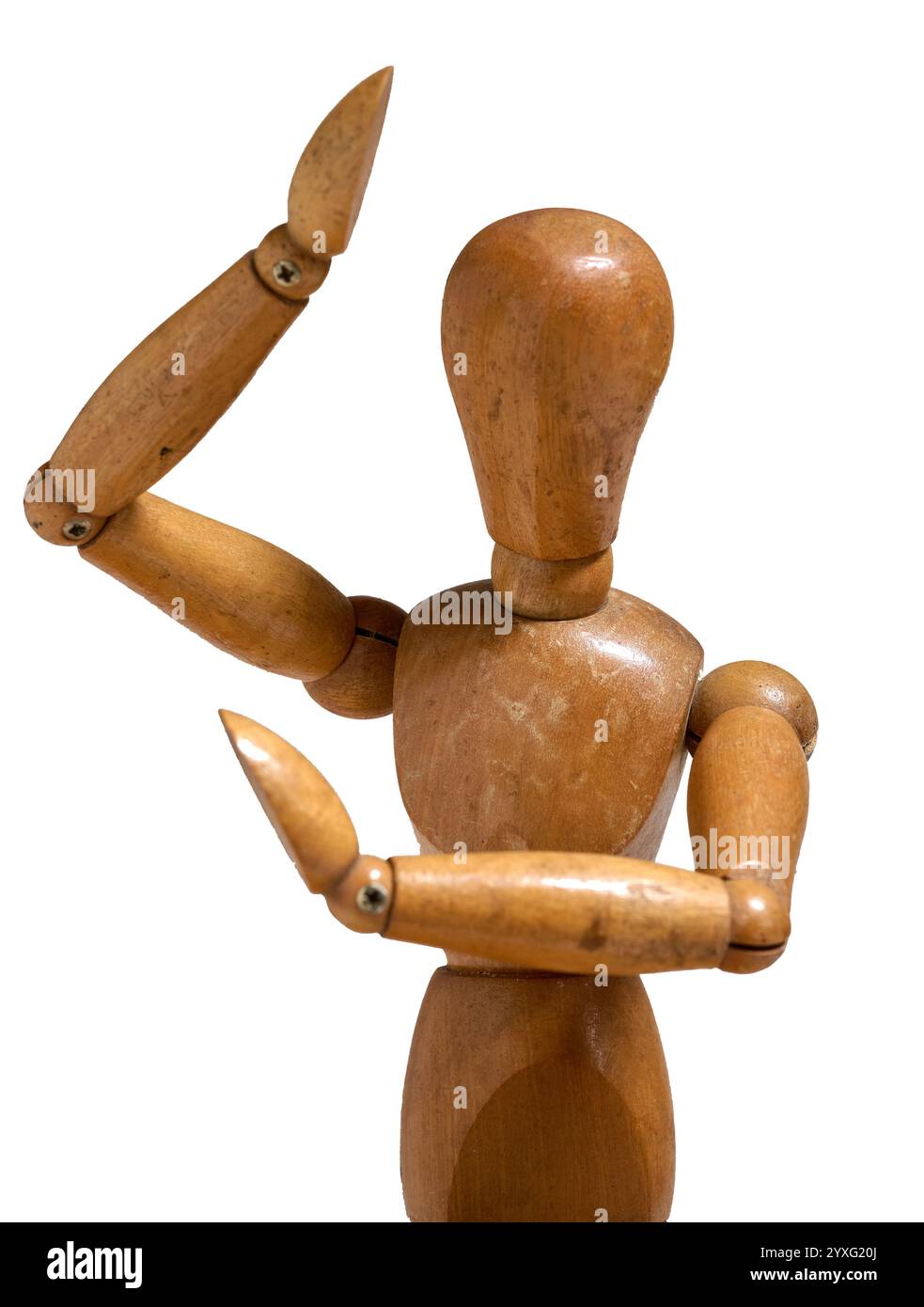 Wooden dummy posing against white background Stock Photo - Alamy