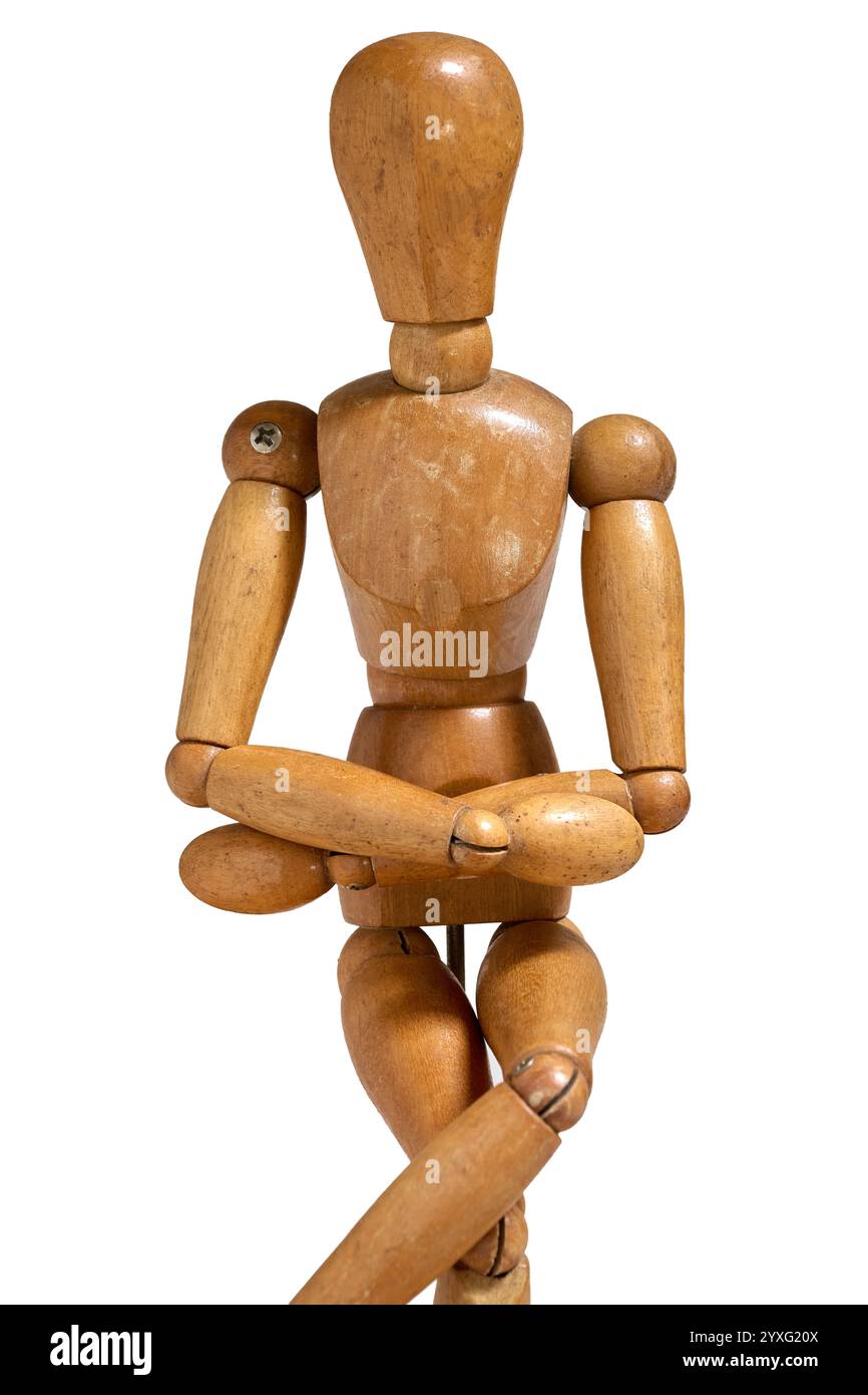Wooden dummy posing against white background Stock Photo - Alamy