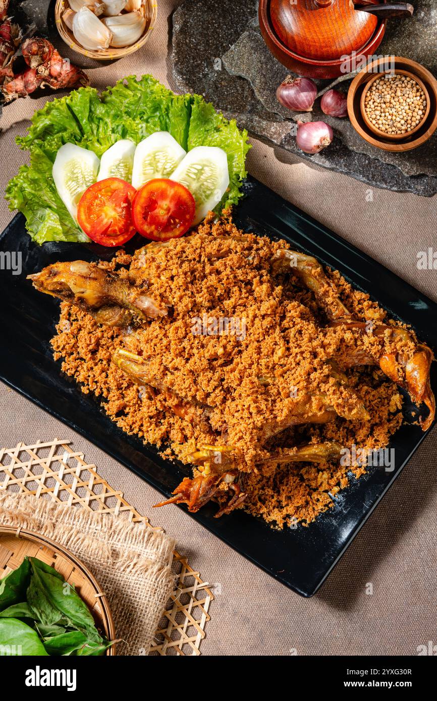 Ayam Kampung Goreng kremes. Traditional fried chicken with spice crumbs ...