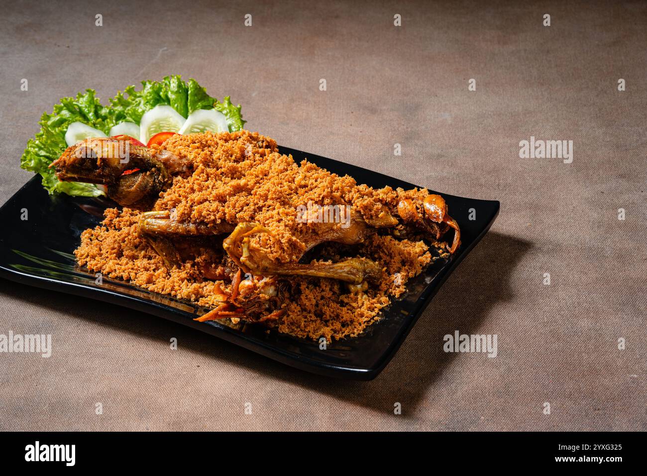 Ayam Kampung Goreng kremes. Traditional fried chicken with spice crumbs ...