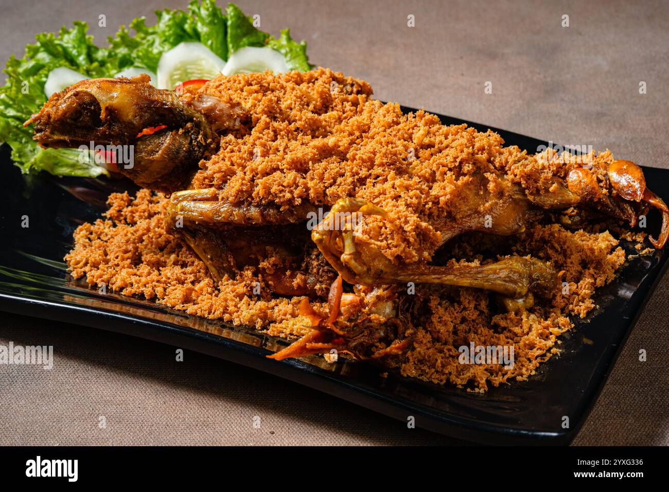 Ayam Kampung Goreng kremes. Traditional fried chicken with spice crumbs ...