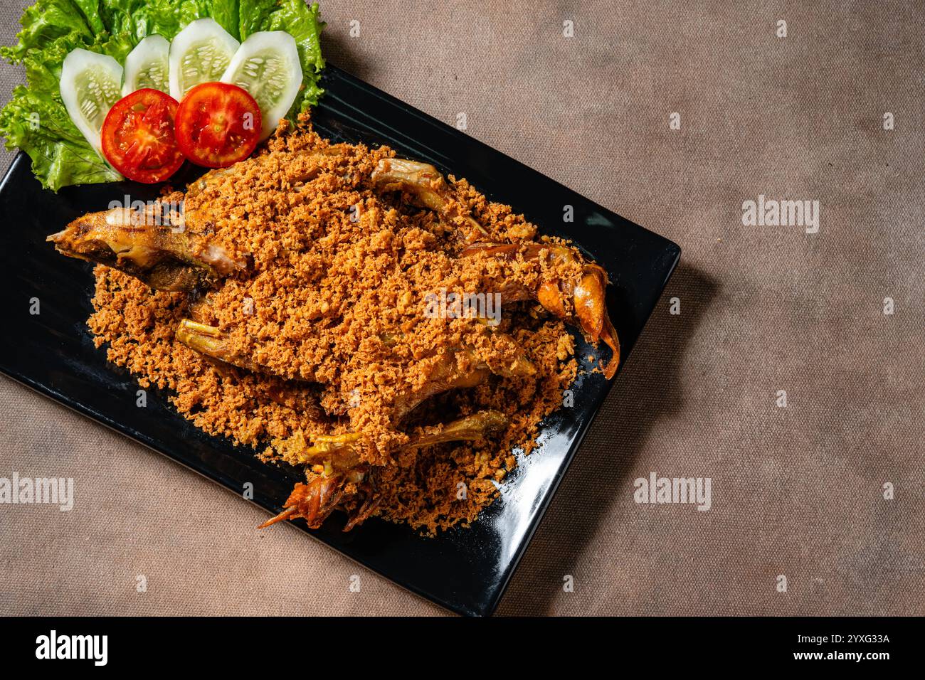 Ayam Kampung Goreng kremes. Traditional fried chicken with spice crumbs ...