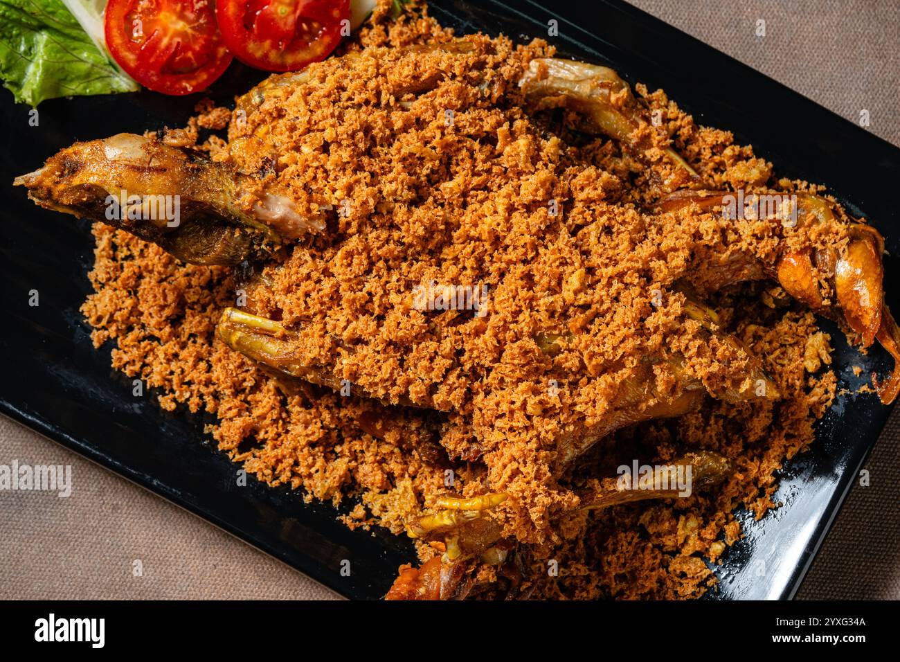 Ayam Kampung Goreng kremes. Traditional fried chicken with spice crumbs ...