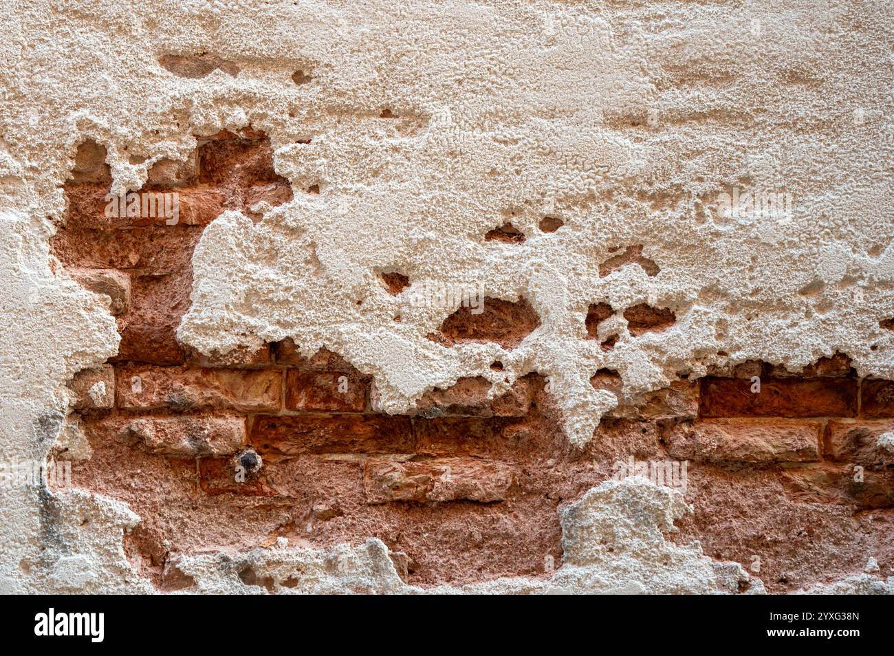Brick wall with pieces of plaster. Wall of an old building in need of ...