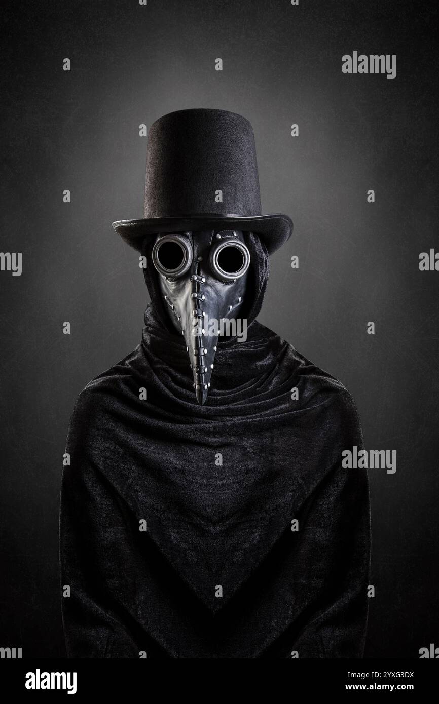 Plague doctor with black vintage top hat at night over dark misty ...