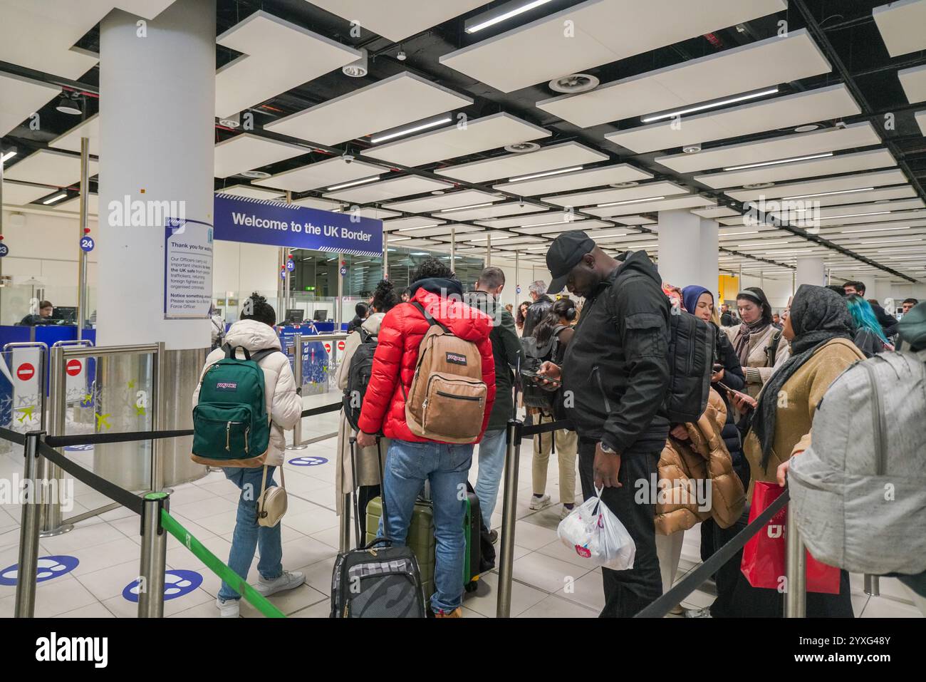 Gatwick, UK. 16 December 2024 Passengers queuing at the UK Border ...
