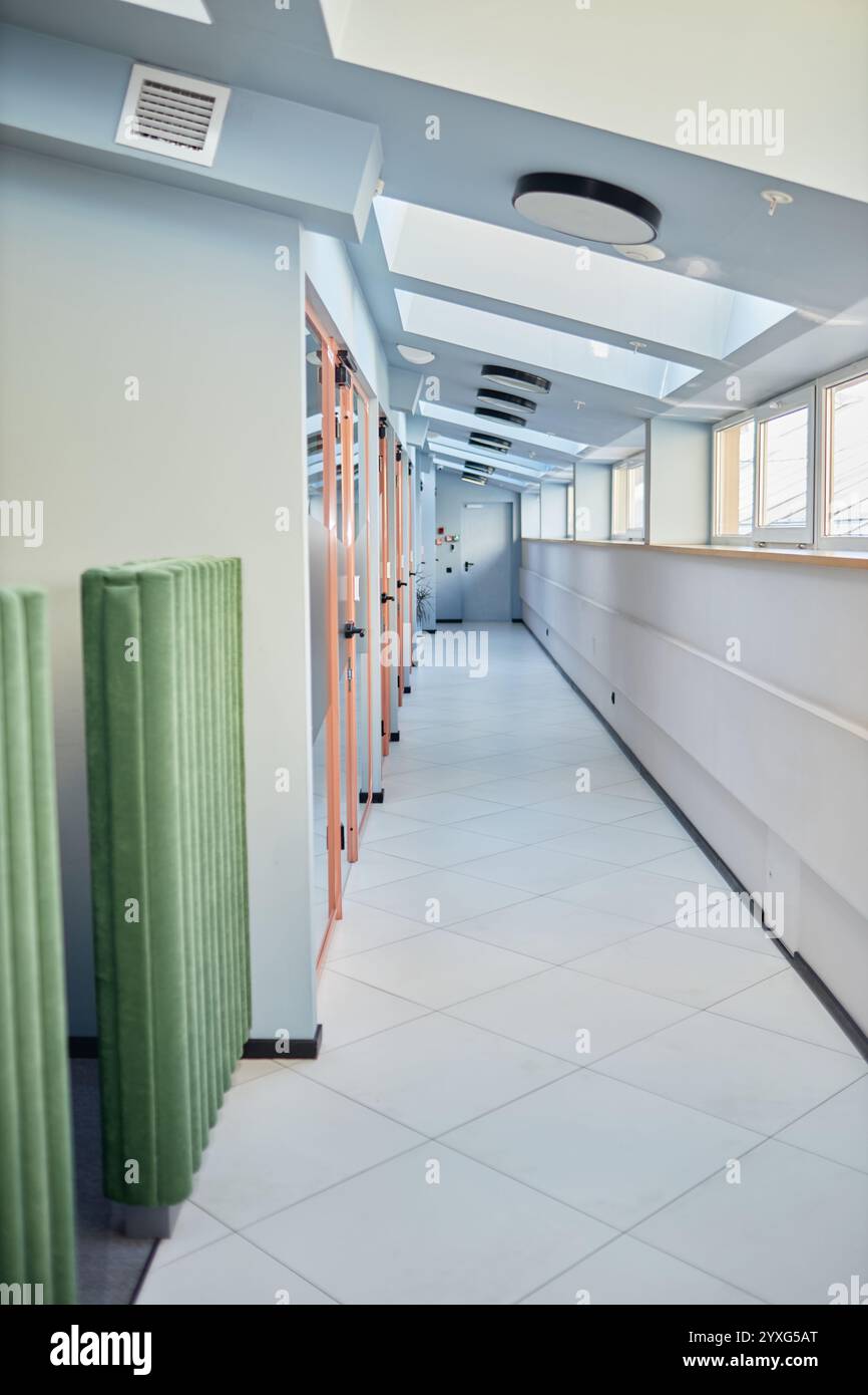 Vertical background shot of corridor with skylight windows and glass ...