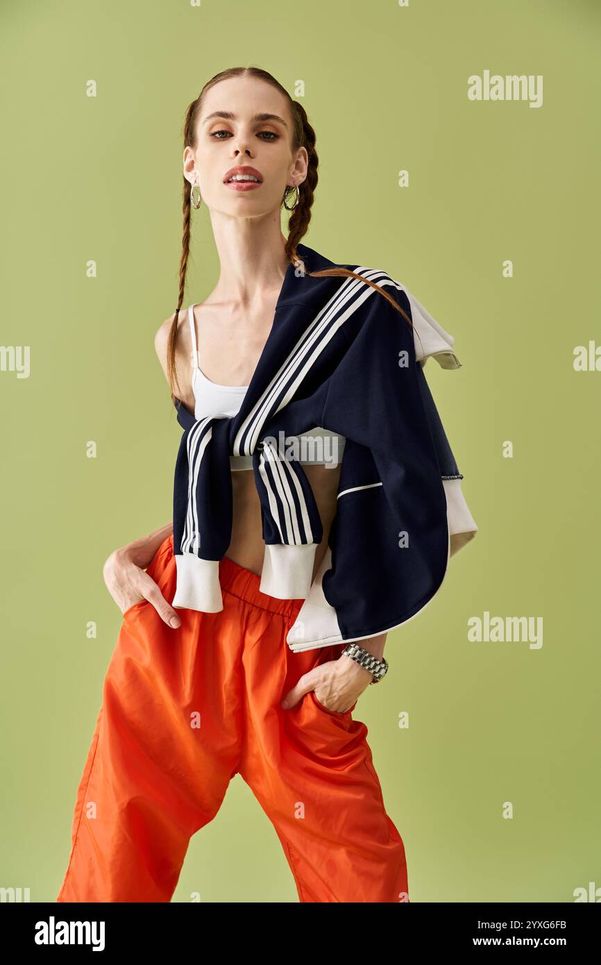 A young woman poses confidently in vibrant attire, highlighting her ...