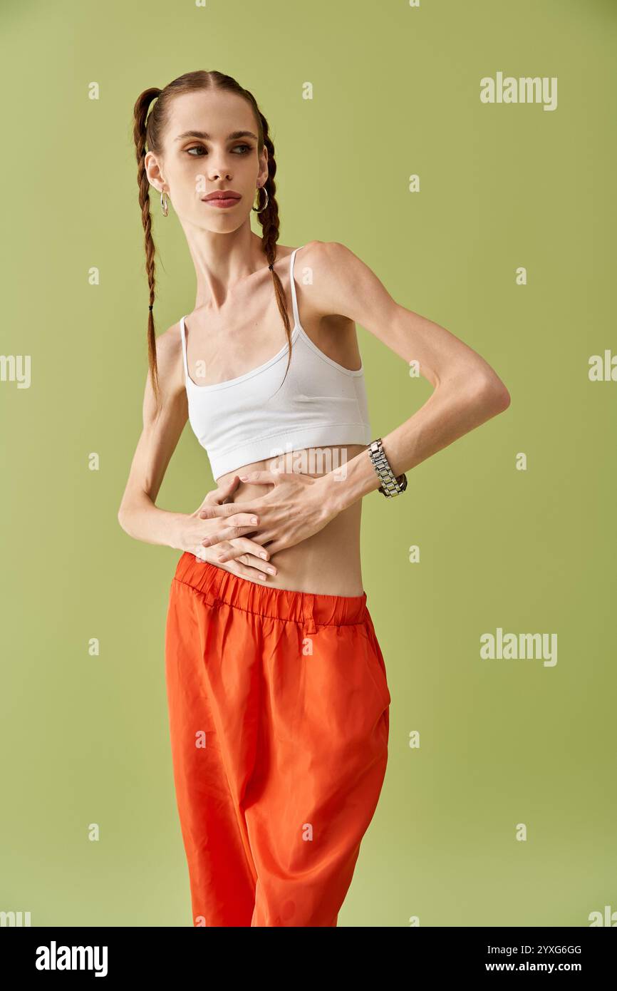 A young woman poses with an expression of struggle, highlighting the ...