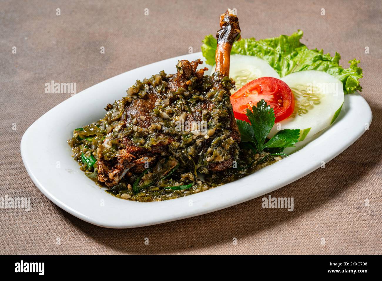 Bebek goreng cabe ijo or fried duck with green chili sauce. Traditional ...