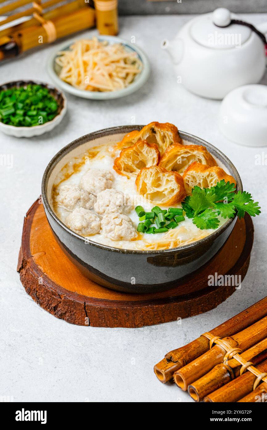 Shredded chicken porridge with ginger, cakwe and spring onions Stock ...