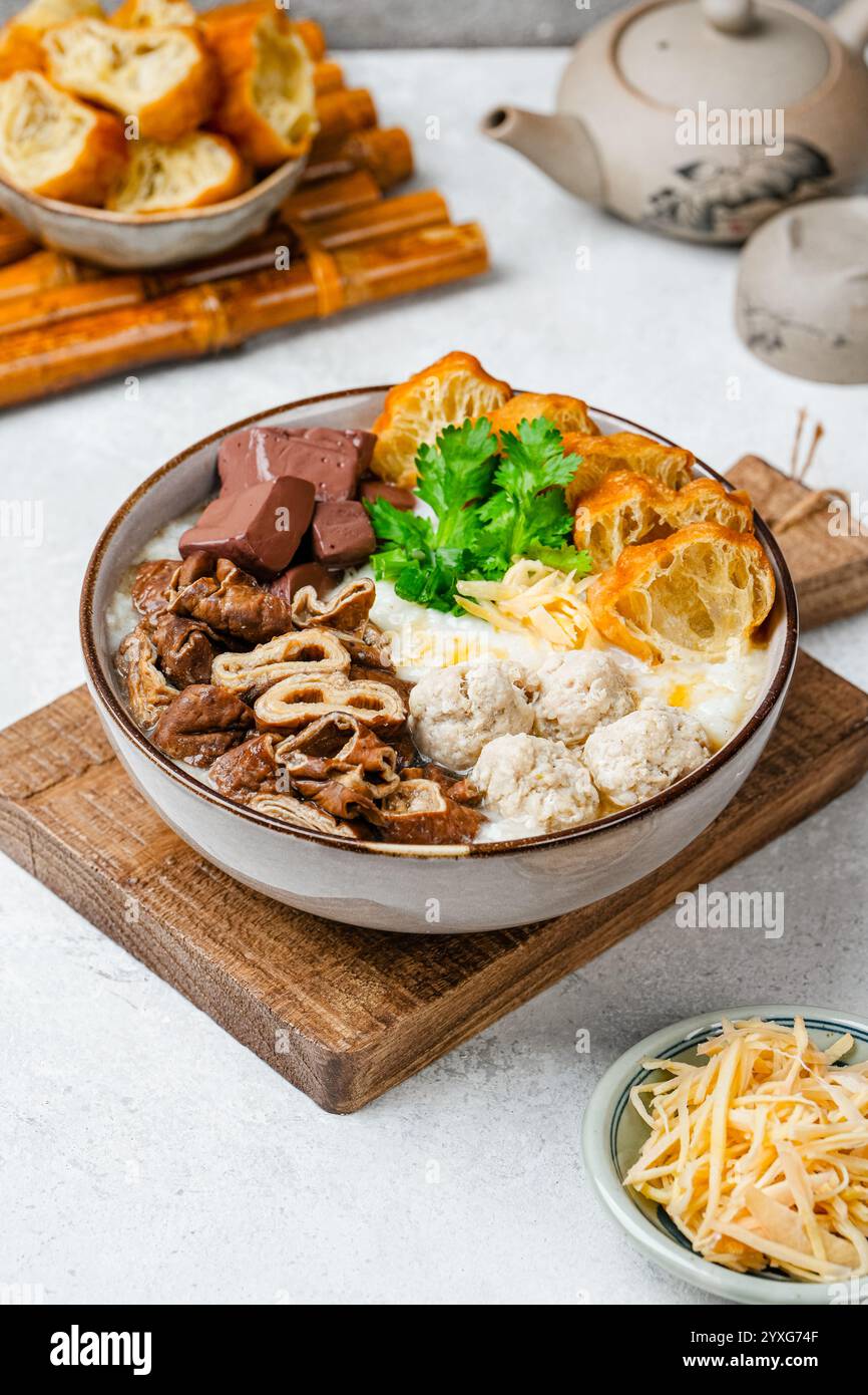 Shredded chicken porridge with ginger, cakwe and spring onions Stock ...