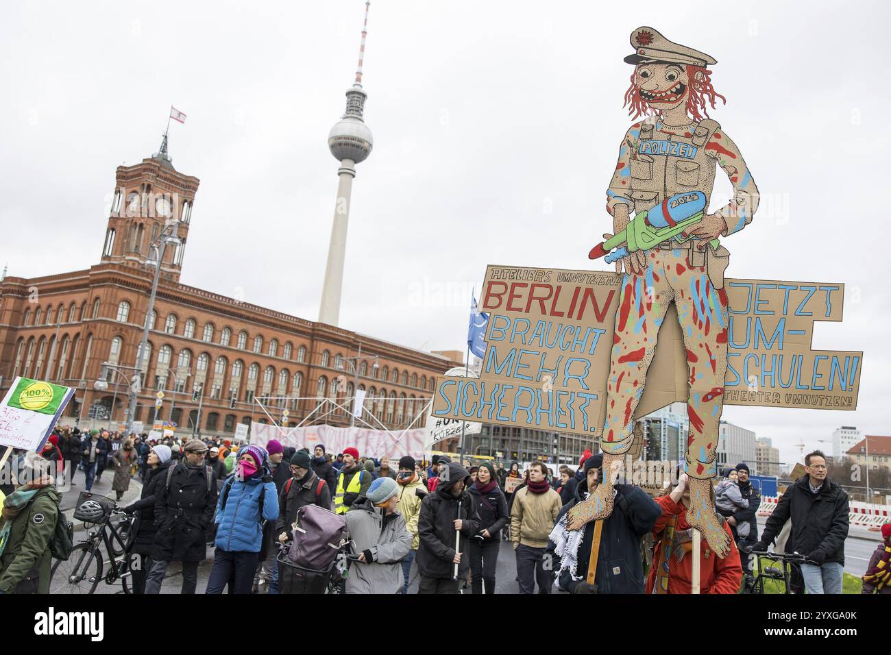 Cardboard sign of a police officer with the text Berlin needs more ...