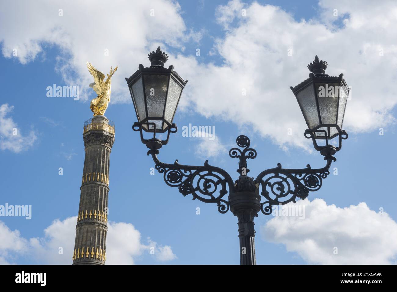 Victory Column next to a beautiful, old street lamp in a blue sky with ...