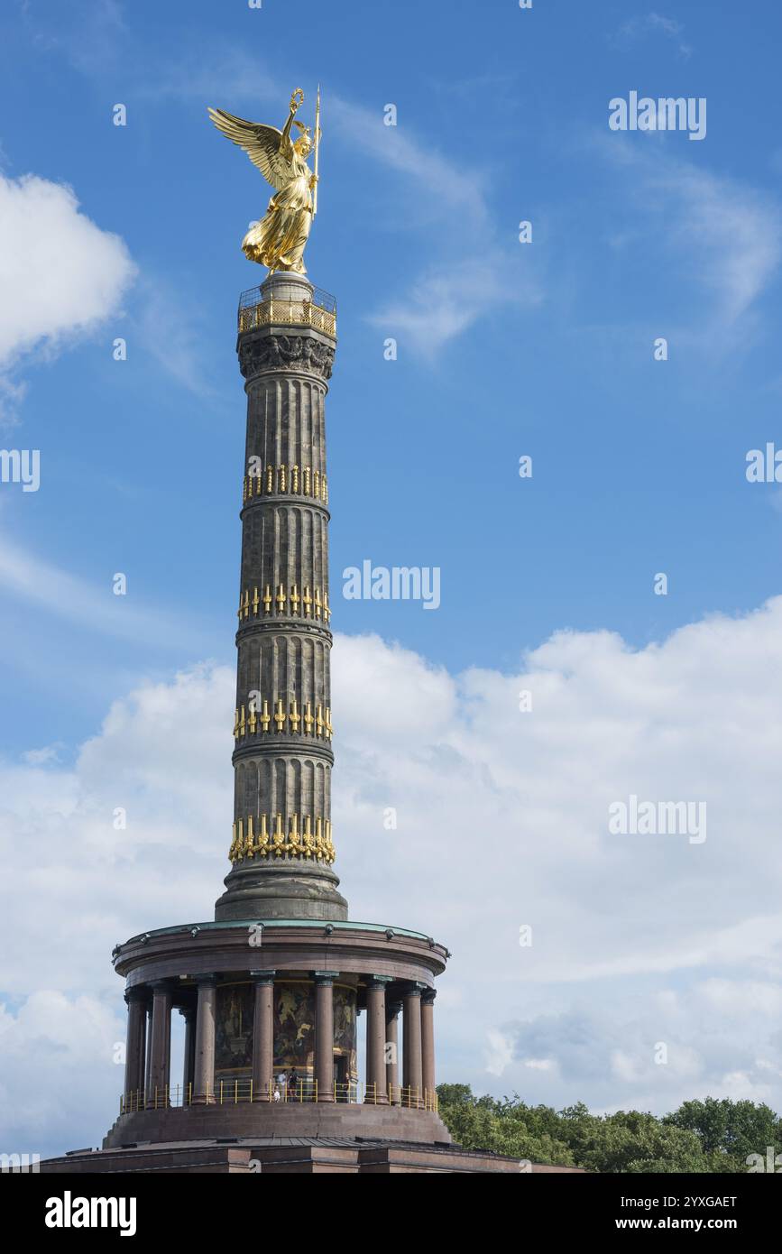 Close-up of the Victory Column in a blue sky with white clouds ...