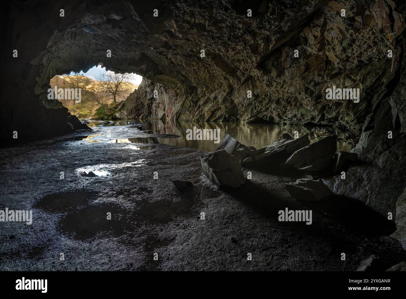 View looking out of Rydal Cave near Ambleside in The Lake District, UK ...
