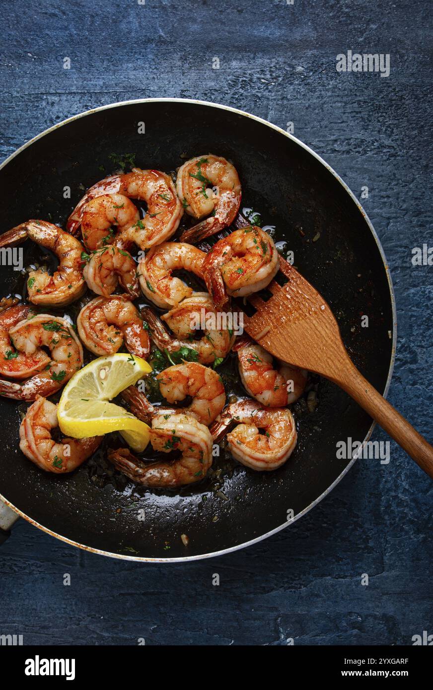 Fried tiger prawns, jumbo, in garlic sauce, in butter, with herbs, in a ...