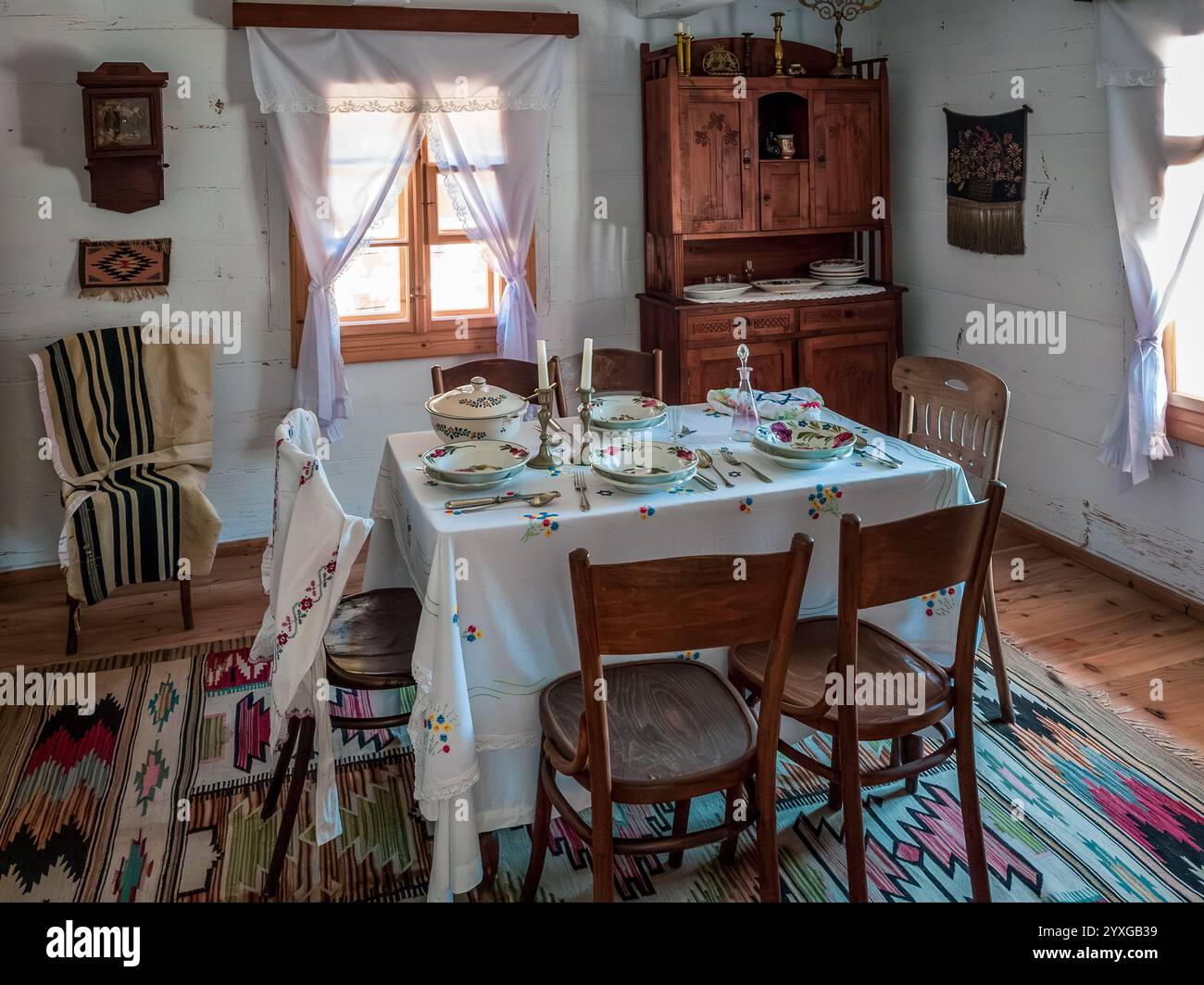 Sanok, Poland - May 4, 2024. A dining table set for a meal in a rustic ...