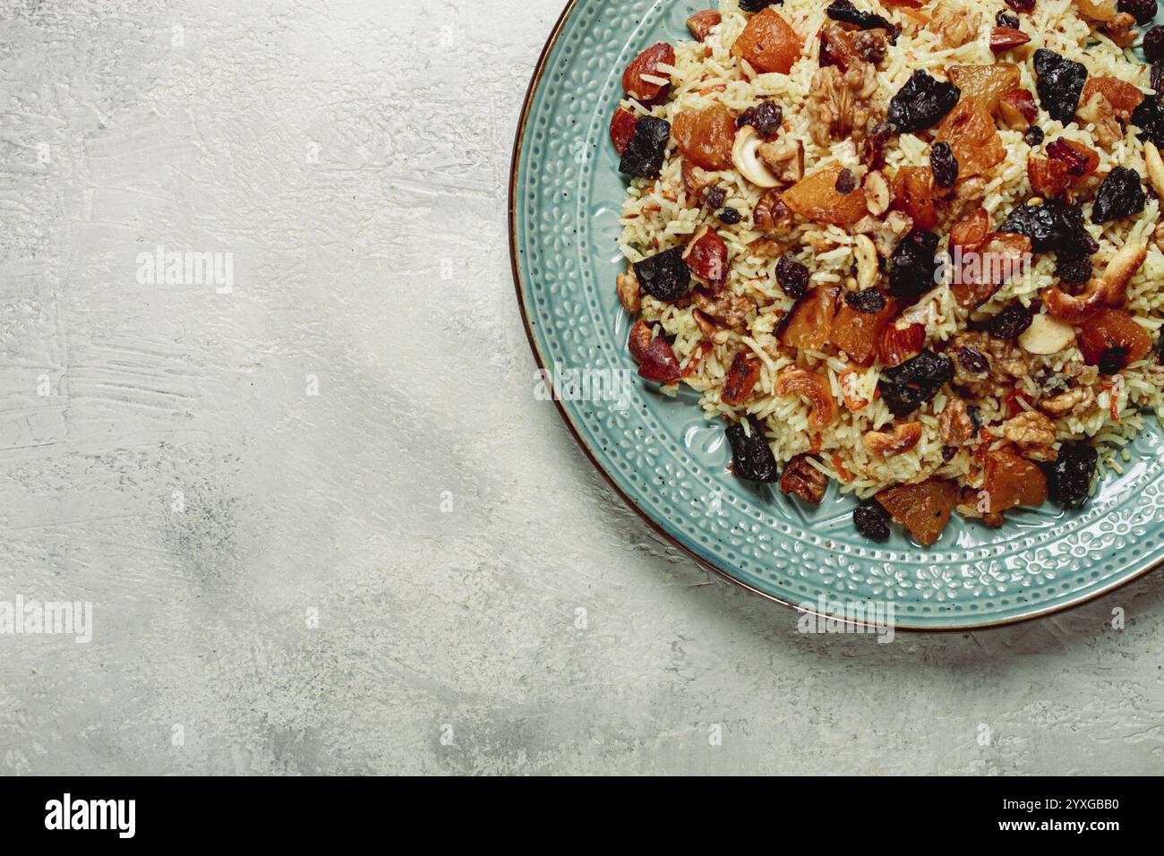 Rice dish, with the addition of dried fruits, nuts and spices of Middle ...