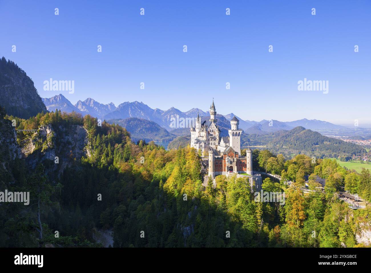 Neuschwanstein Castle in the colourful autumn landscape, nestled ...