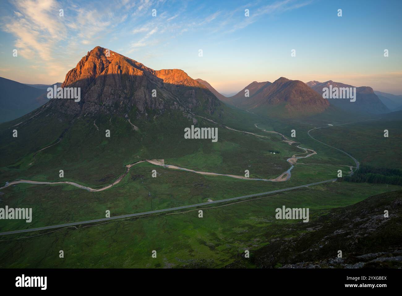 Sunrise at Glencoe with golden light on mountain peaks, Scottish ...