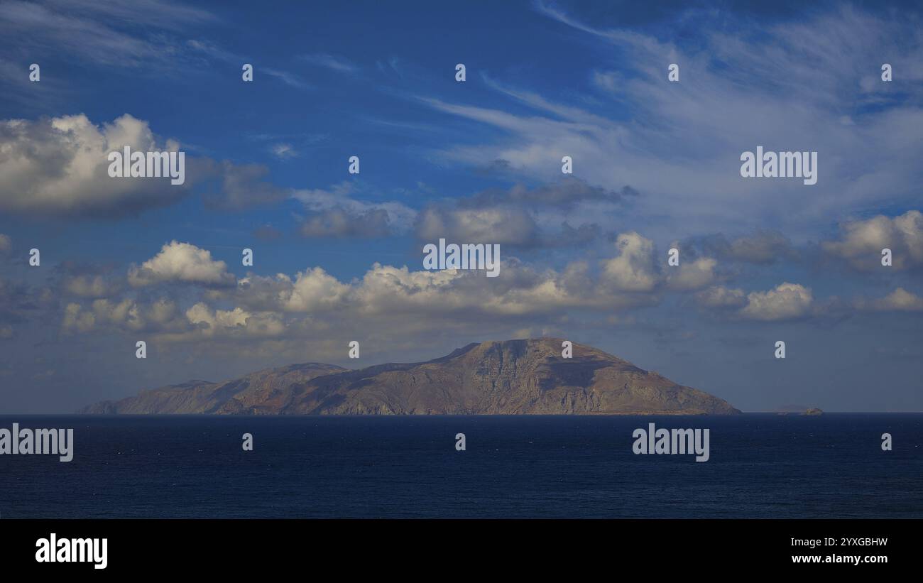 Sky and sea in clear daylight, wide view of an island, Kassos Island ...